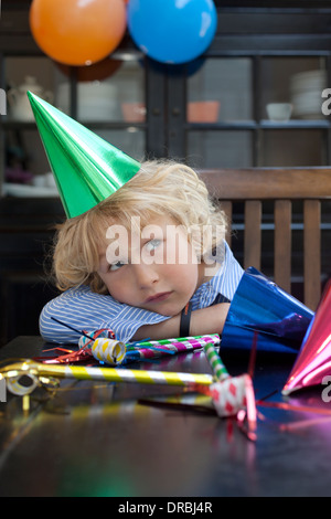 Sad kid alone at her birthday Stock Photo - Alamy