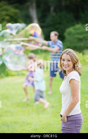 Mother playing with his daughter in the backyard Stock Photo - Alamy