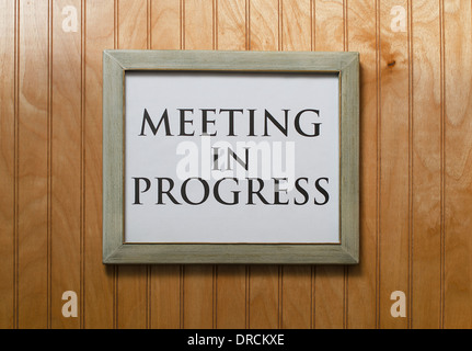 Meeting in progress sign on office door concept for business team Stock ...