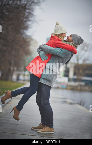 Portrait of attractive cheerful guy holding pile frstal giftboxes eve ...