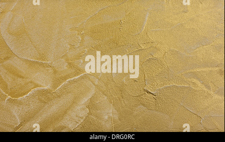 Stucco wall with gold paint Stock Photo - Alamy