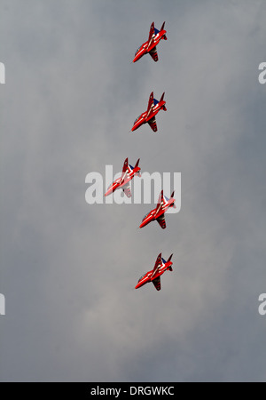 Five of the Red Arrows in formation during a flypast with coloured ...