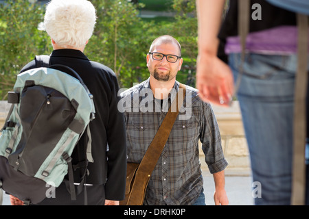 Confident Male Grad Student Walking On Campus Stock Photo - Alamy
