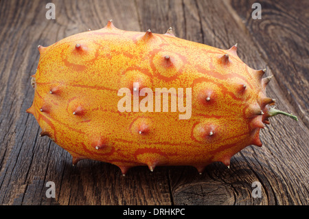 African horned cucumber on the wooden table Stock Photo - Alamy
