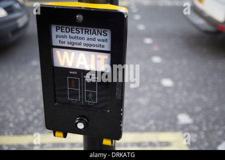 Illuminated wait sign at pedestrian crossing, London Stock Photo - Alamy