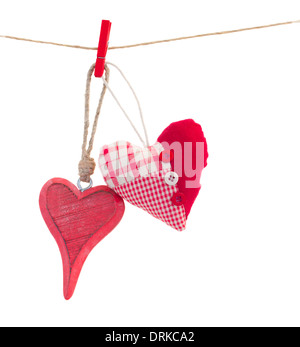 Valentine's Day heart bound and tied by pink and purple ribbon on red ...