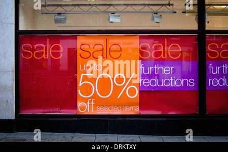 Sale signs in a shop window offering 50 per cent off Stock Photo ...
