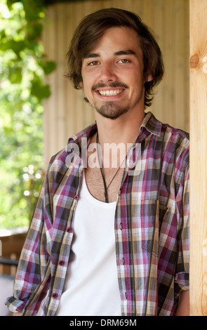 Portrait of unconfident young man Stock Photo - Alamy