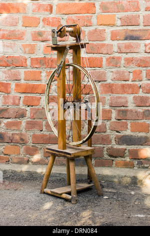 Spinning in vintage style on a brick wall Stock Photo - Alamy