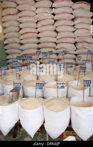 Different types of rice in sacks on wooden background Stock Photo - Alamy