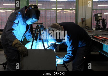 Neumuenster, Germany. 22nd Jan, 2014. Prison inmates work in a ...