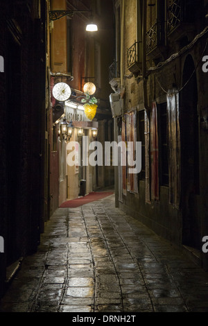 NIGHT IMAGE OF RAIN ON HOTEL WINDOW, LOOKING AT STREET LIGHTS IN THE ...