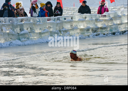 Winter swimmers swim in the Songhua River in Jilin City, northeast ...
