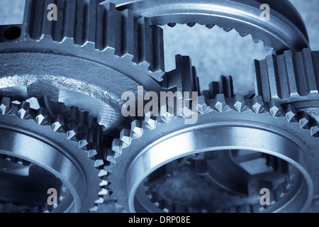 Steel gears meshing together Stock Photo - Alamy
