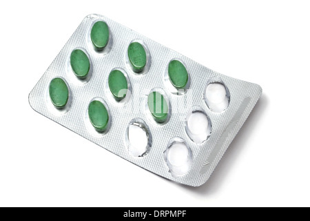 Package of green pills isolated on white background Stock Photo - Alamy