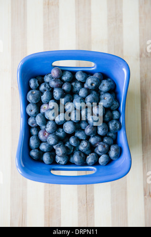 Blueberry antioxidants on a wooden table on a background of Norwegian ...