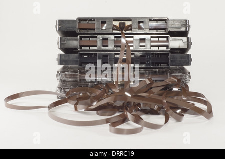 A white cassette tape is hanging from a string with the words Time for ...