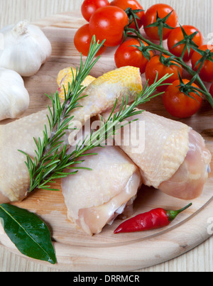 uncooked chicken thigh -raw - chicken with vegetables Stock Photo - Alamy