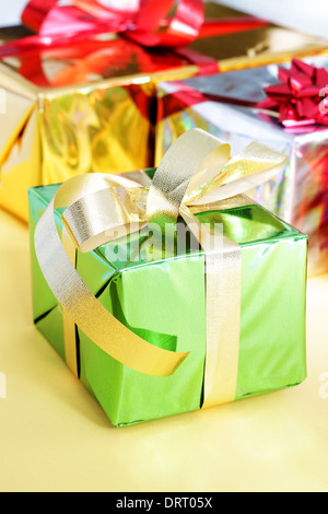 Colored gift boxes with colorful ribbons and pompon. White background ...