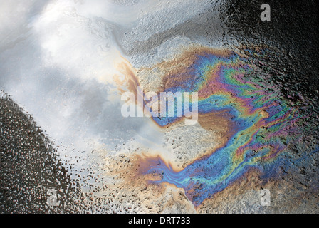 Puddle of oil on the ground Stock Photo - Alamy