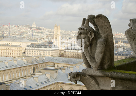 Gargoyle Stryga on the western facade of the Notre-Dame Cathedral with ...