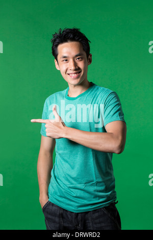 Happy Chinese Student Guy Gesturing Ok While Posing Outdoors At Campus ...
