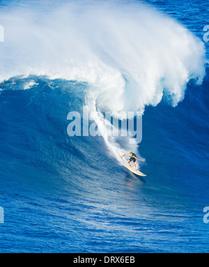 Extreme surfer riding giant ocean wave in Hawaii Stock Photo - Alamy