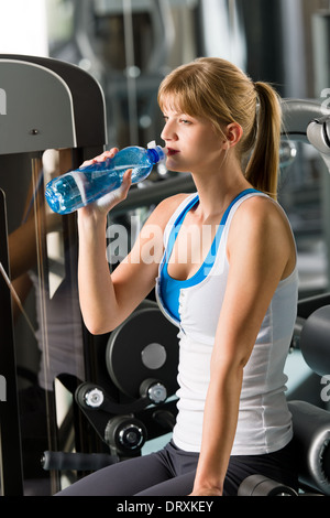 Woman drink water at fitness machine Stock Photo - Alamy