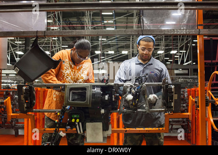 Workers make dashboards for Ford at Detroit Manufacturing Systems Stock ...