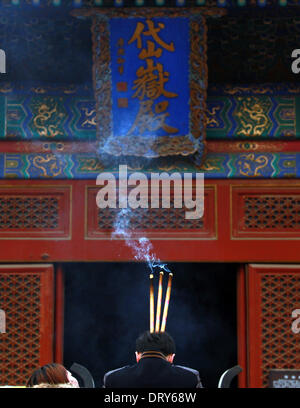 Beijing, CHINA, China. 31st Jan, 2014. Chinese light incense sticks and ...