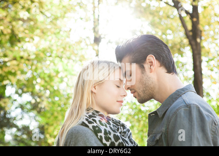 Two women nuzzling foreheads Stock Photo - Alamy