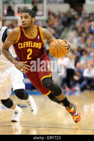 Dallas Mavericks' Kyrie Irving, center, holds his leg after suffering ...