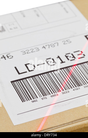 Scanning barcode on shipping label with handheld scanner. Order ...