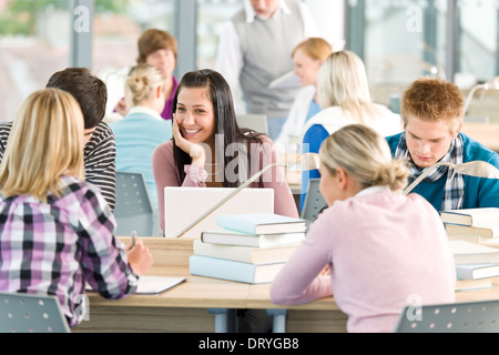 Group of students study in modern school classroom. Beautiful female ...