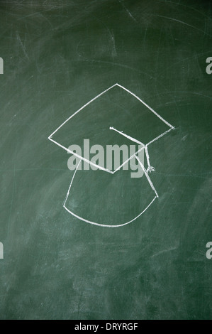 Doctorial hat on blackboard Stock Photo - Alamy