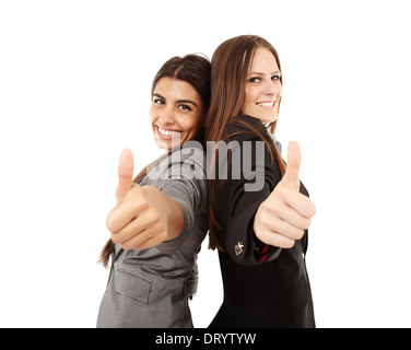 Two beautiful businesswomen smiling happy and confident. Sitting with ...