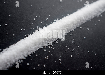 sugar granules arranged and scattered close up macro Stock Photo - Alamy