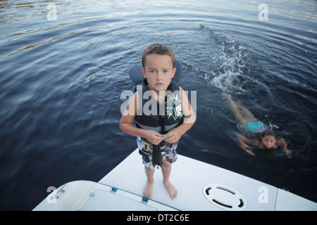 Scared boy looking up Stock Photo - Alamy