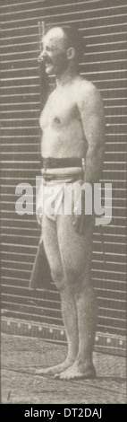 A man wearing a pelvis cloth is shown positioning a bayonet. The ...