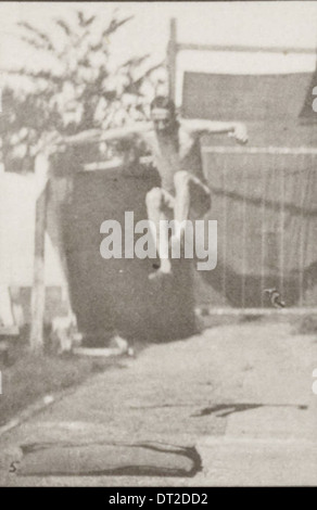 A photograph of a man wearing a pelvis cloth, standing and jumping ...