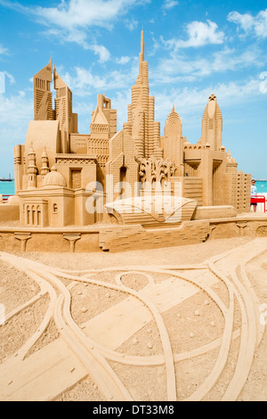 Sand sculpture of skyline of Dubai with many landmark buildings on ...