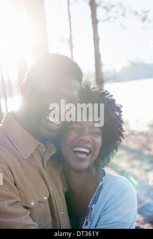 Happy couple hugging each other in their kitchen Stock Photo - Alamy