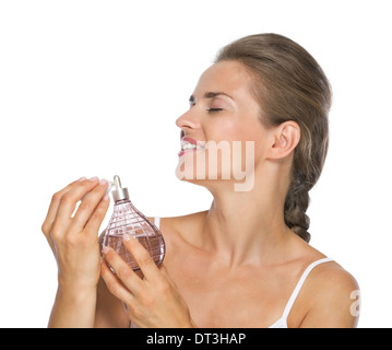 Young woman applying perfume Stock Photo - Alamy