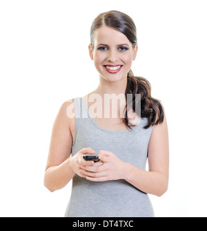 Portrait of brunette woman holding mobile phone and using silver laptop ...