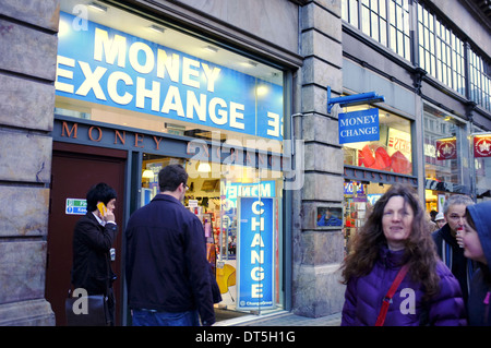 People at a Money Exchange bureau de change shop, for foreign currency ...