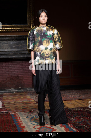 Model walks runway for Tia Cibani presentation at Fall/Winter 2014 ...