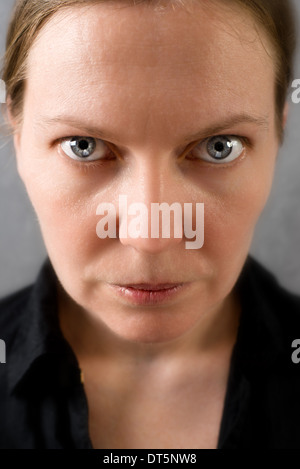 portrait of a young woman without make up and with long hair on a white ...