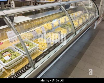 Varieties of fresh made pasta on display at an italian supermarket ...