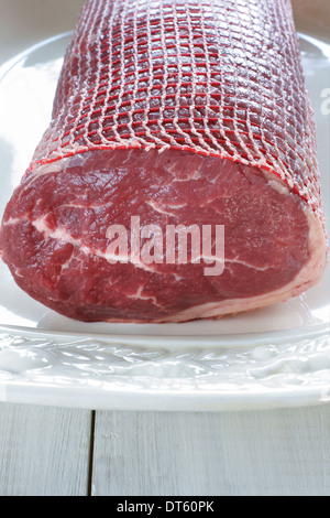Silverside sirloin beef cut, raw meat on butcher table with herbs ...