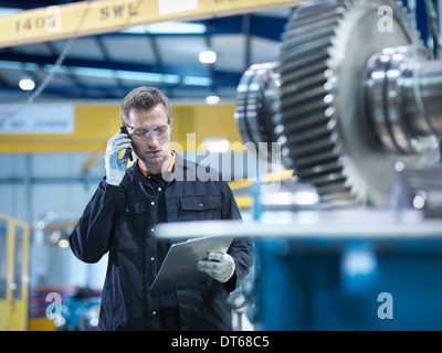Men working in the telephone factory ; manufacturing of telephone Stock ...